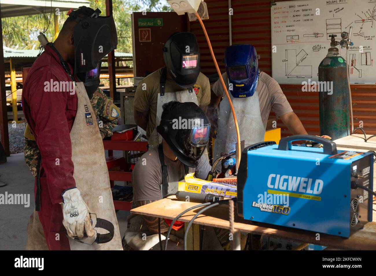 A group of Timor-Leste Defense Force soldiers watch New Zealand Army ...