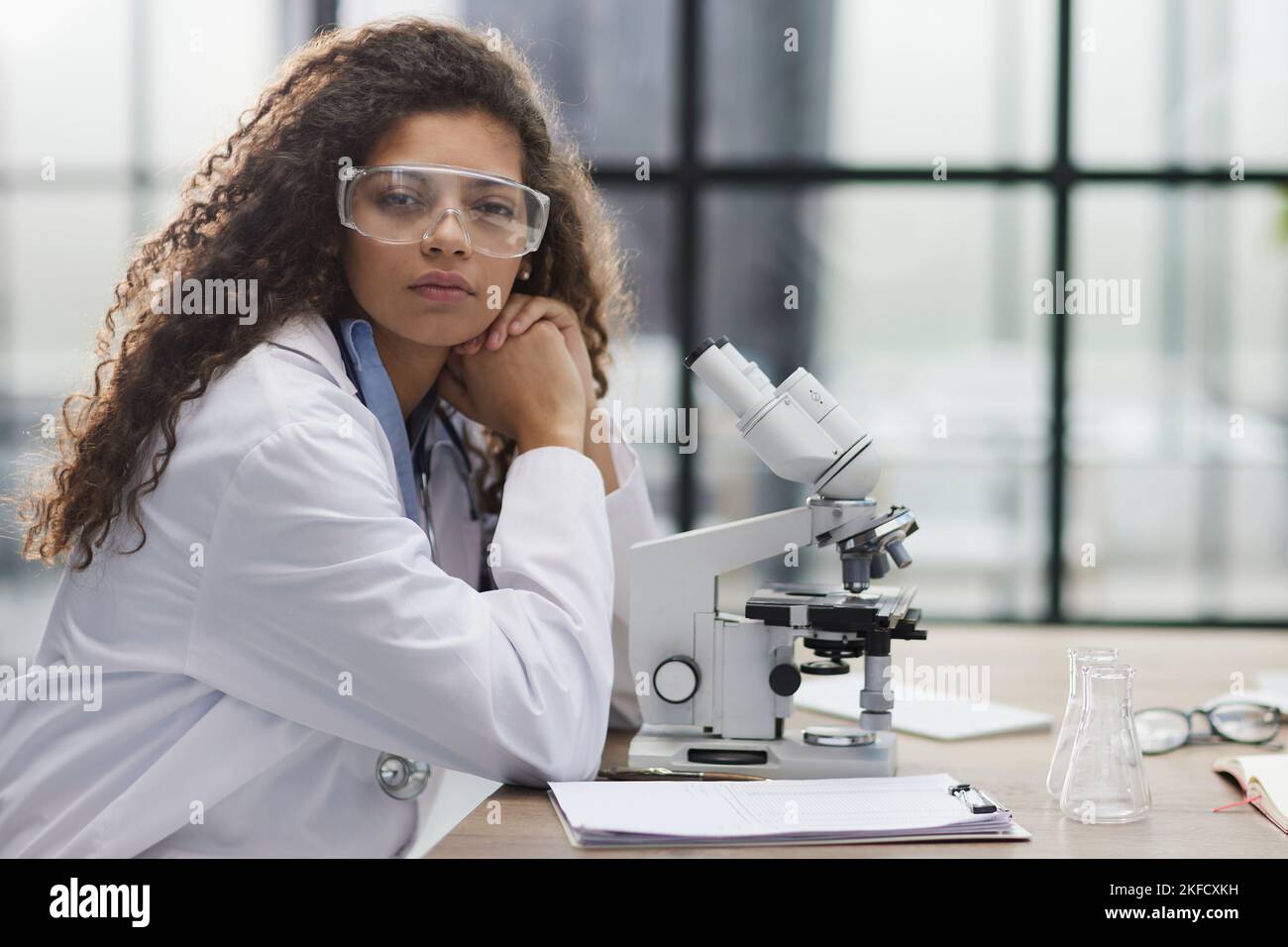 Young woman in biological laboratory. Attractive young female scientis ...
