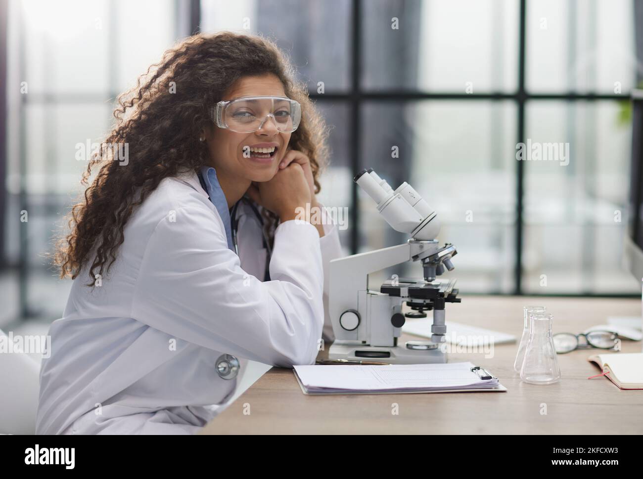 Young woman in biological laboratory. Attractive young female scientis ...
