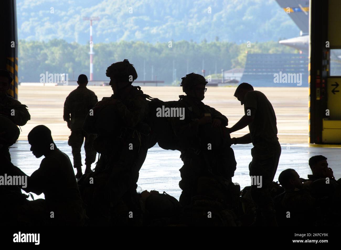 U.S. Army soldiers assigned to the 173rd Airborne Brigade don, rig, and ...