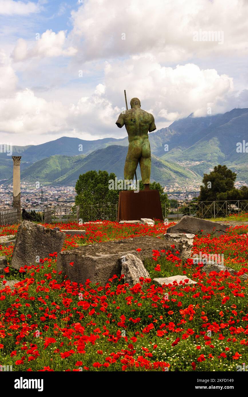 A vertical of a bronze roman statue of a man without hands in Pompeii ...