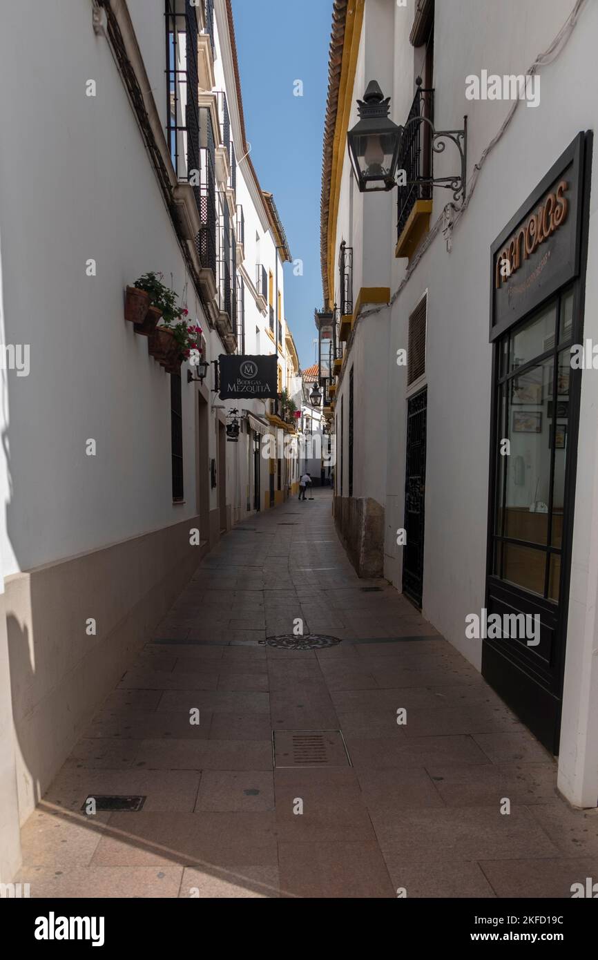 A vertical shot of a narrow street in Cordoba, Spain Stock Photo - Alamy
