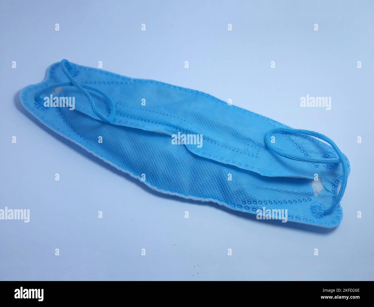 Close up isolated on white blue masks to protect against viruses and ...