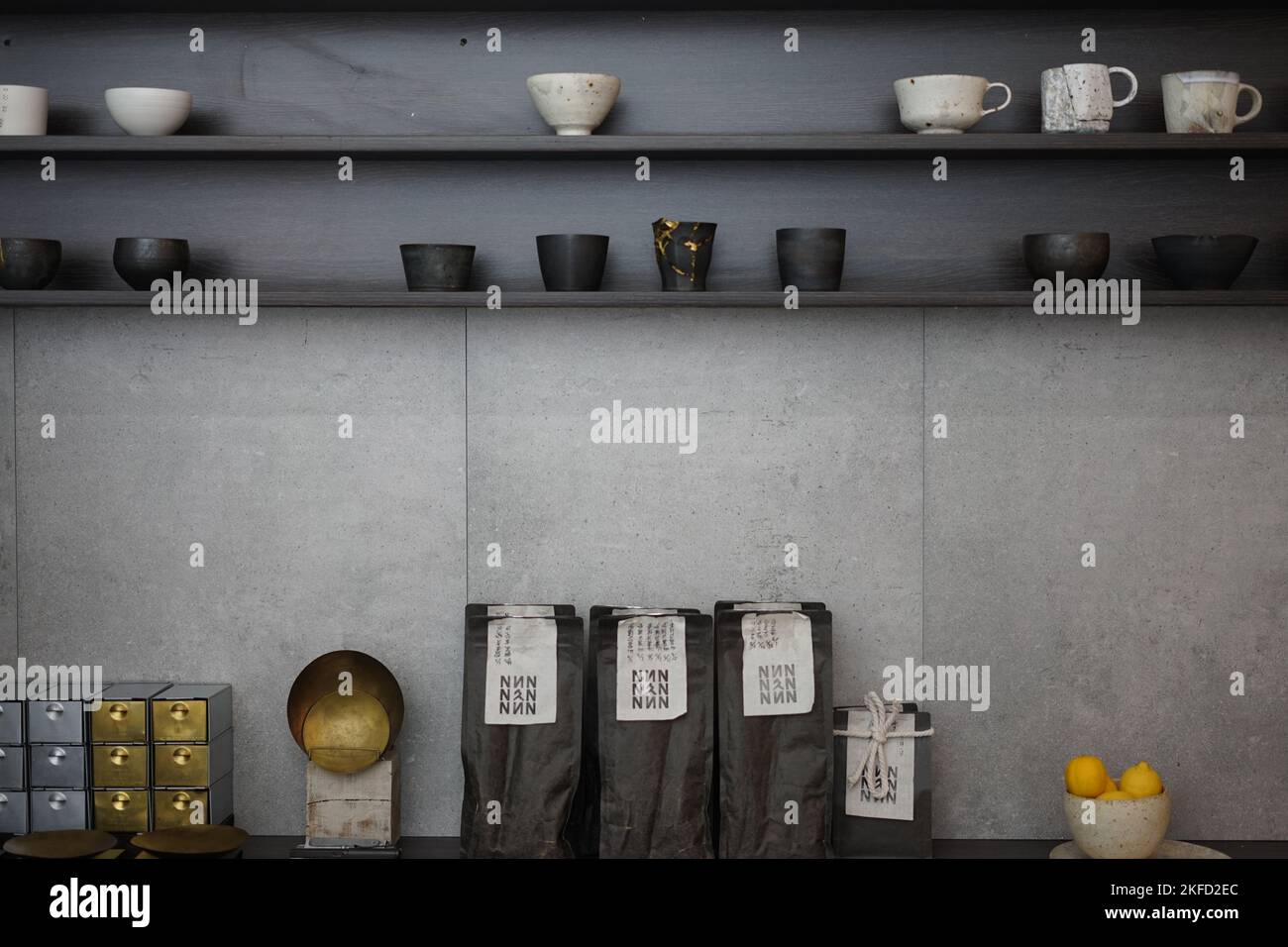 A front view of an aesthetic modern coffee shop countertop with coffee ...