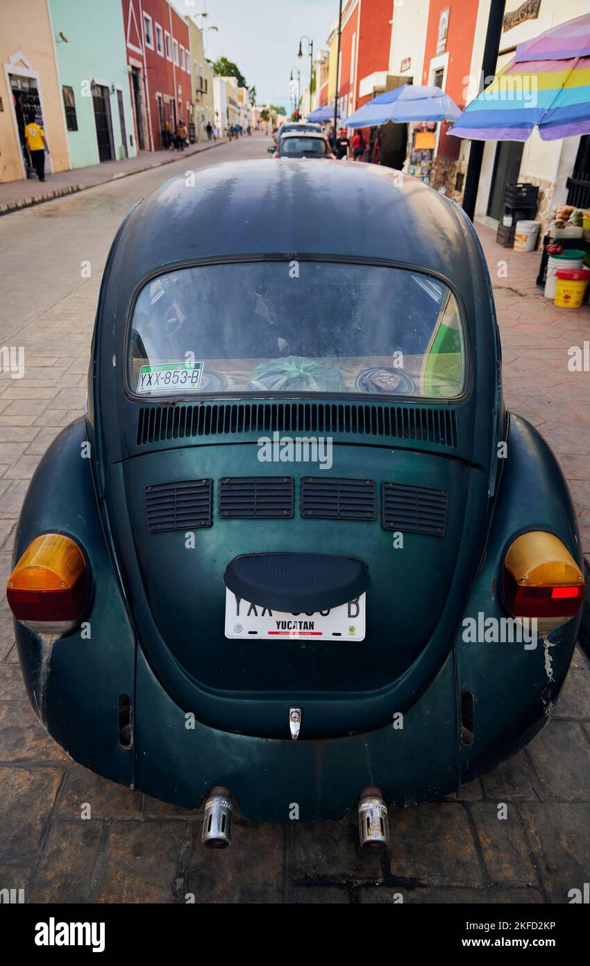 A back shot of a Volkswagen Kaefer vintage car in turquoise color in ...