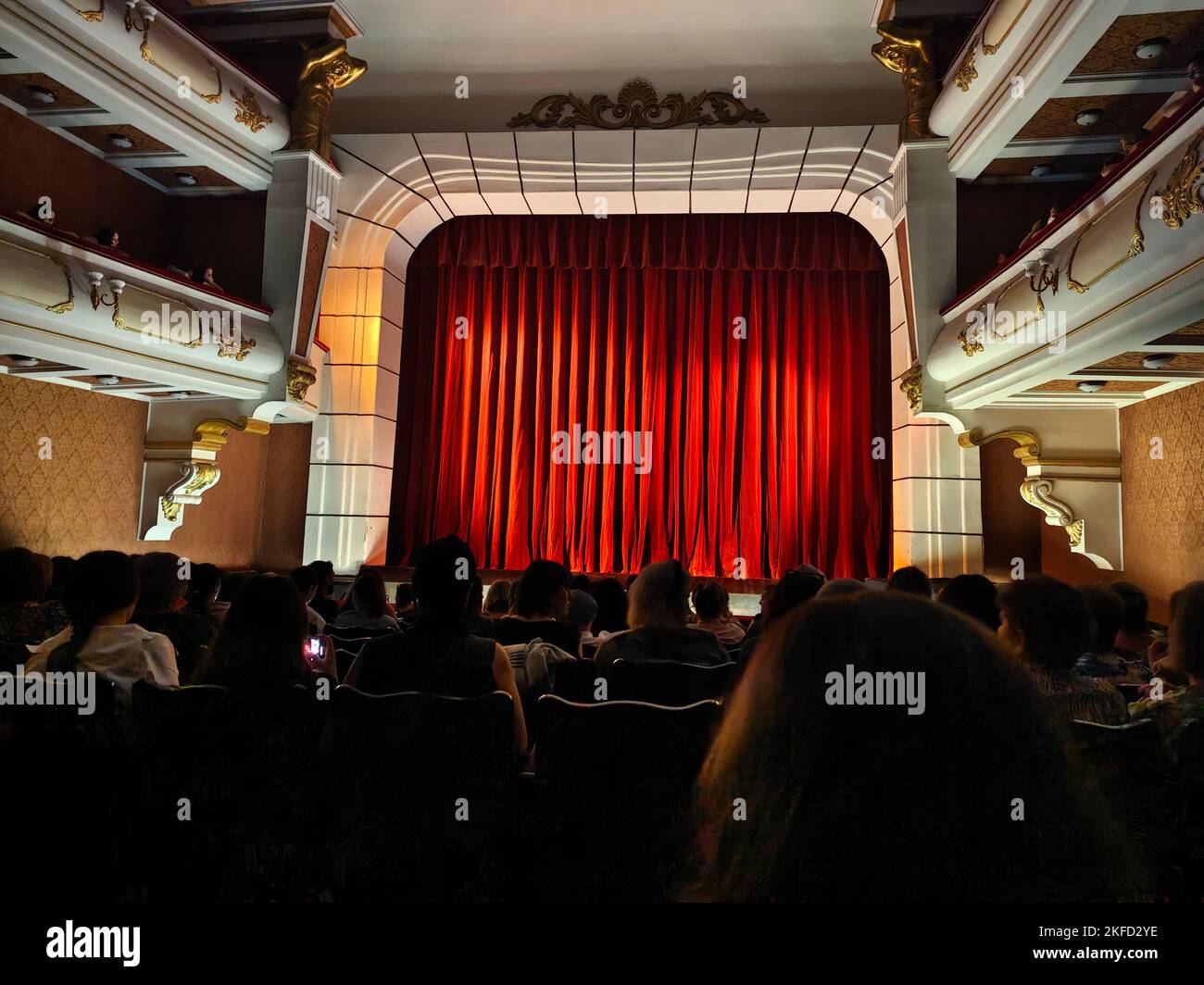 An interior of the Kutaisi State Opera Theater big stage with red ...