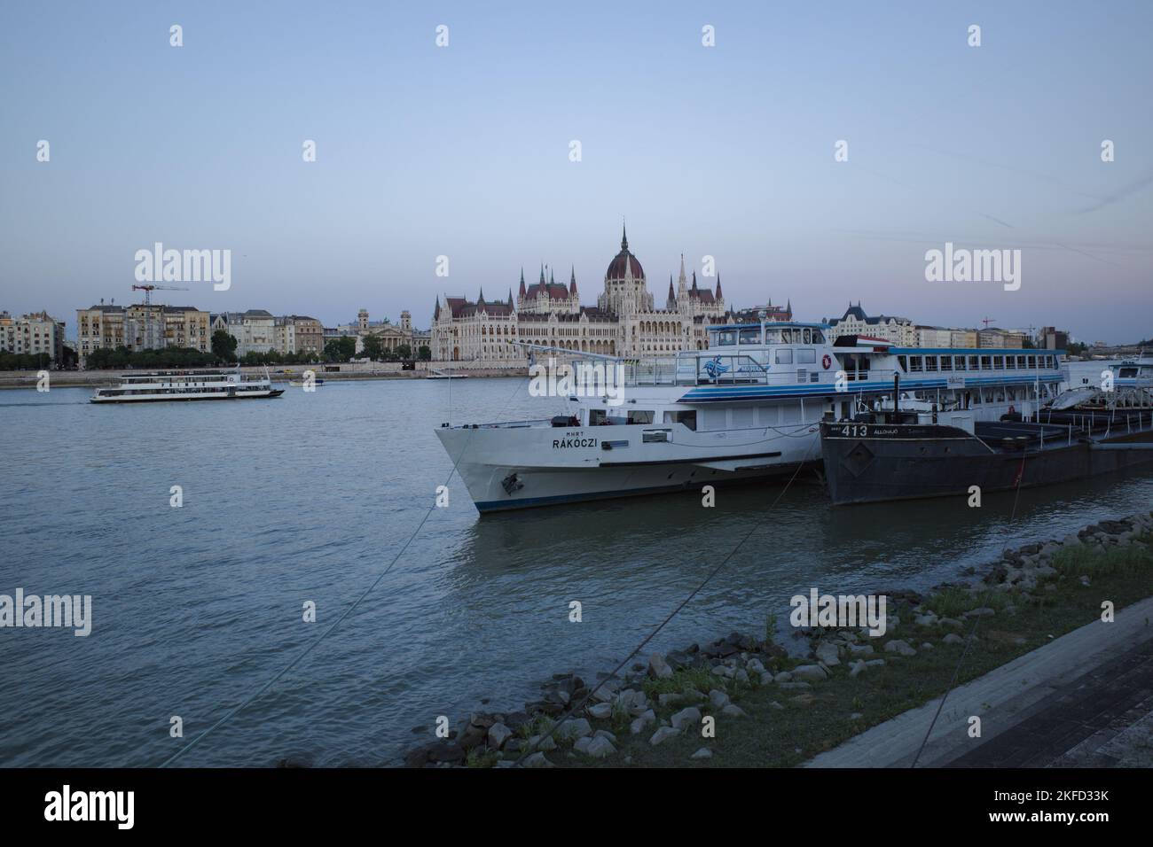 The Hungarian Parliament Building by the Danube River in the evening ...