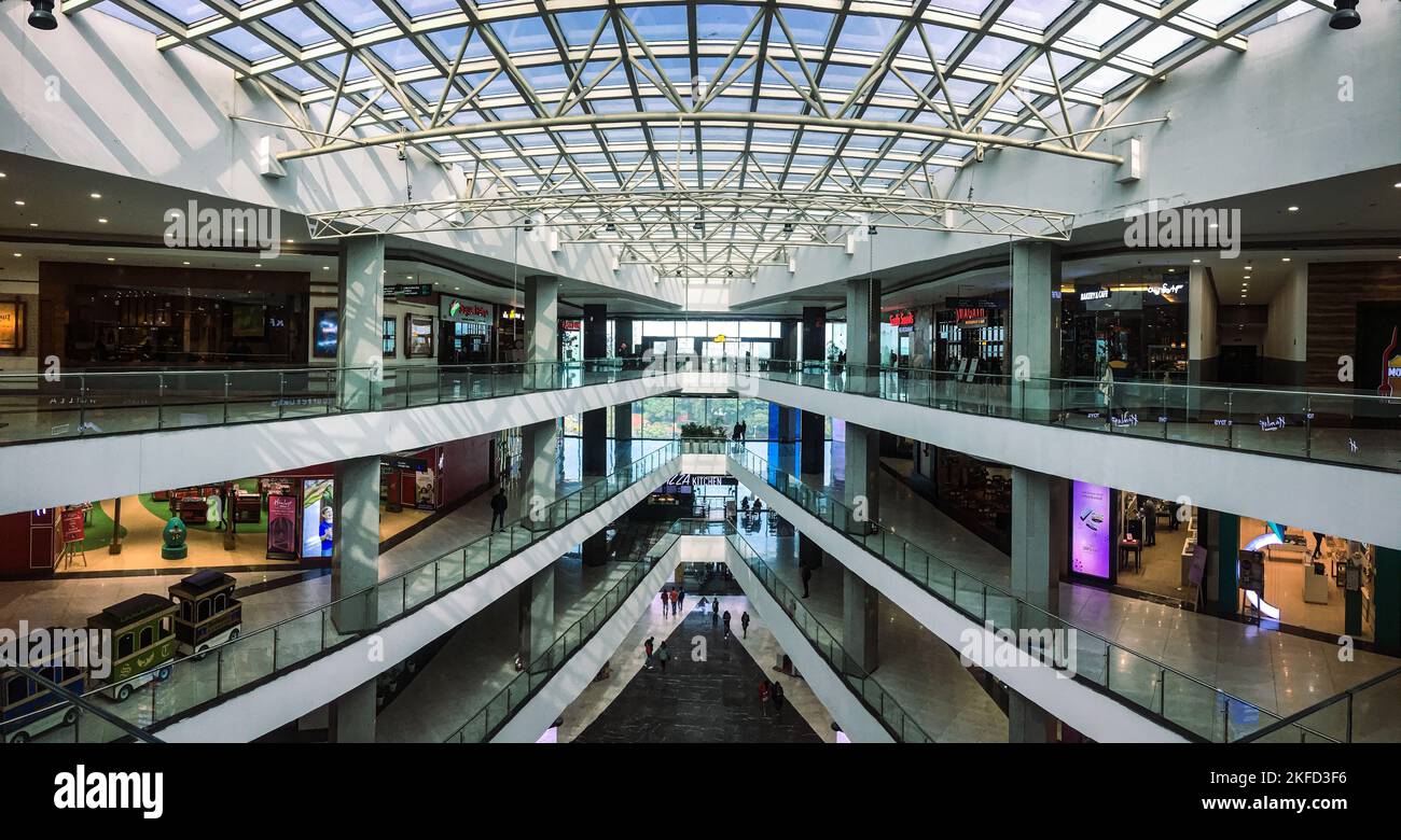 An interior of a shopping mall with a glass ceiling in Chandigarh ...