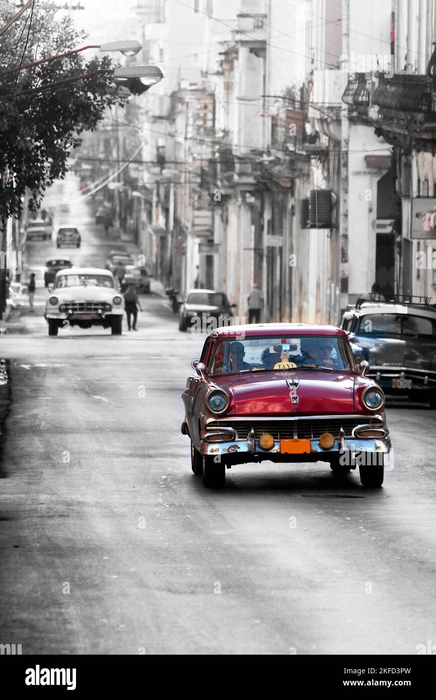 Classic cars riding in a street in Havana. Cuba Stock Photo - Alamy