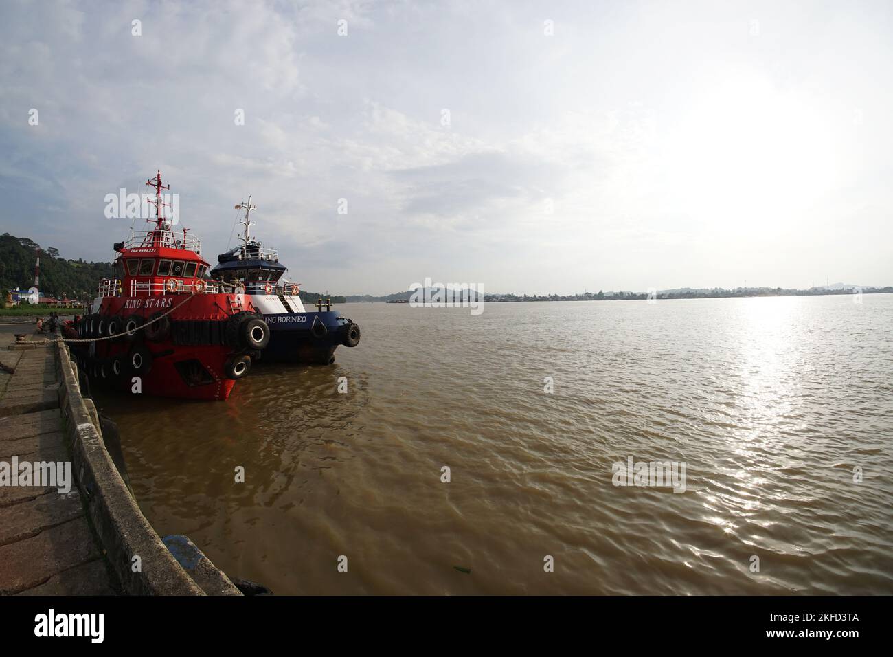 The King stars red and blue ships docked in the Samarinda Harbor on a ...