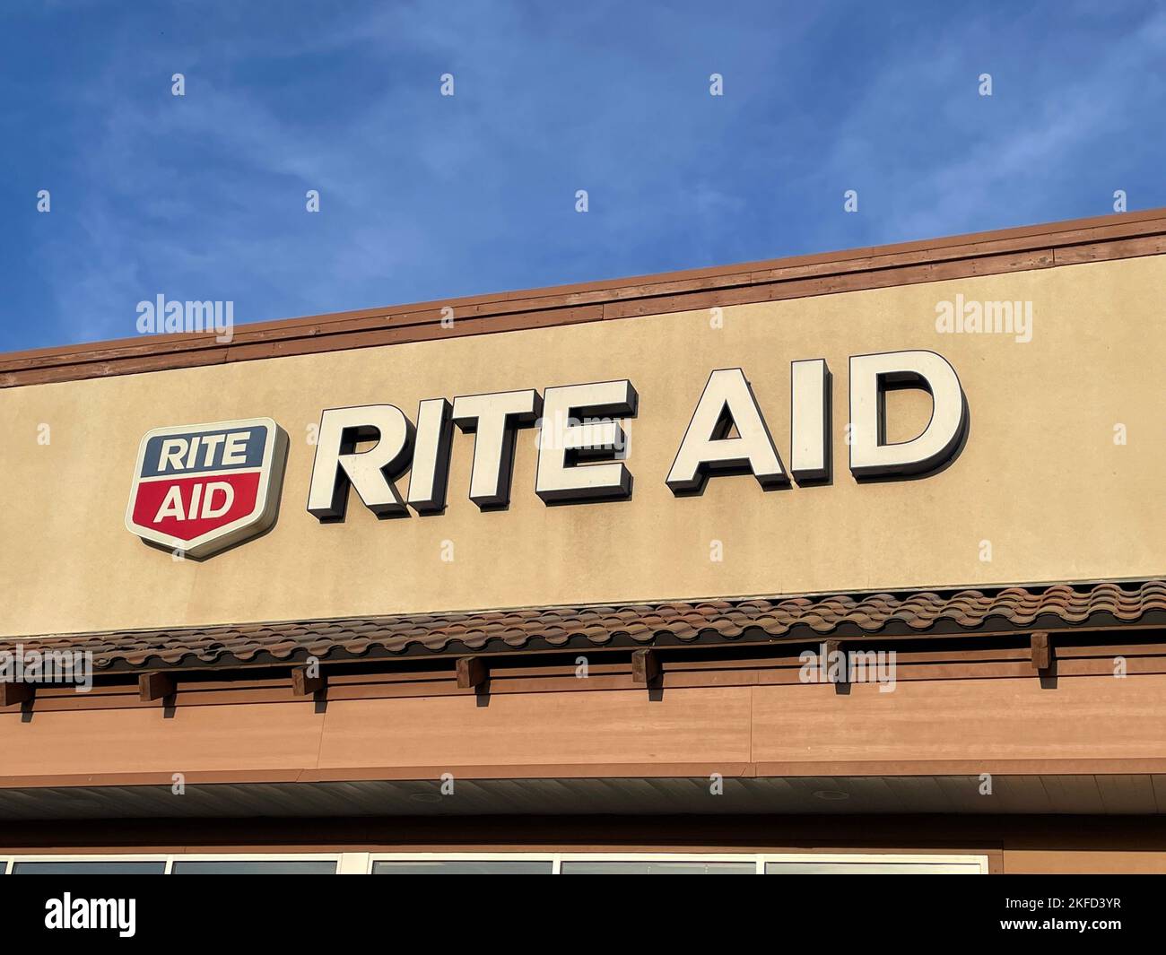 A Rite Aid Store Sign against a blue sky Stock Photo - Alamy
