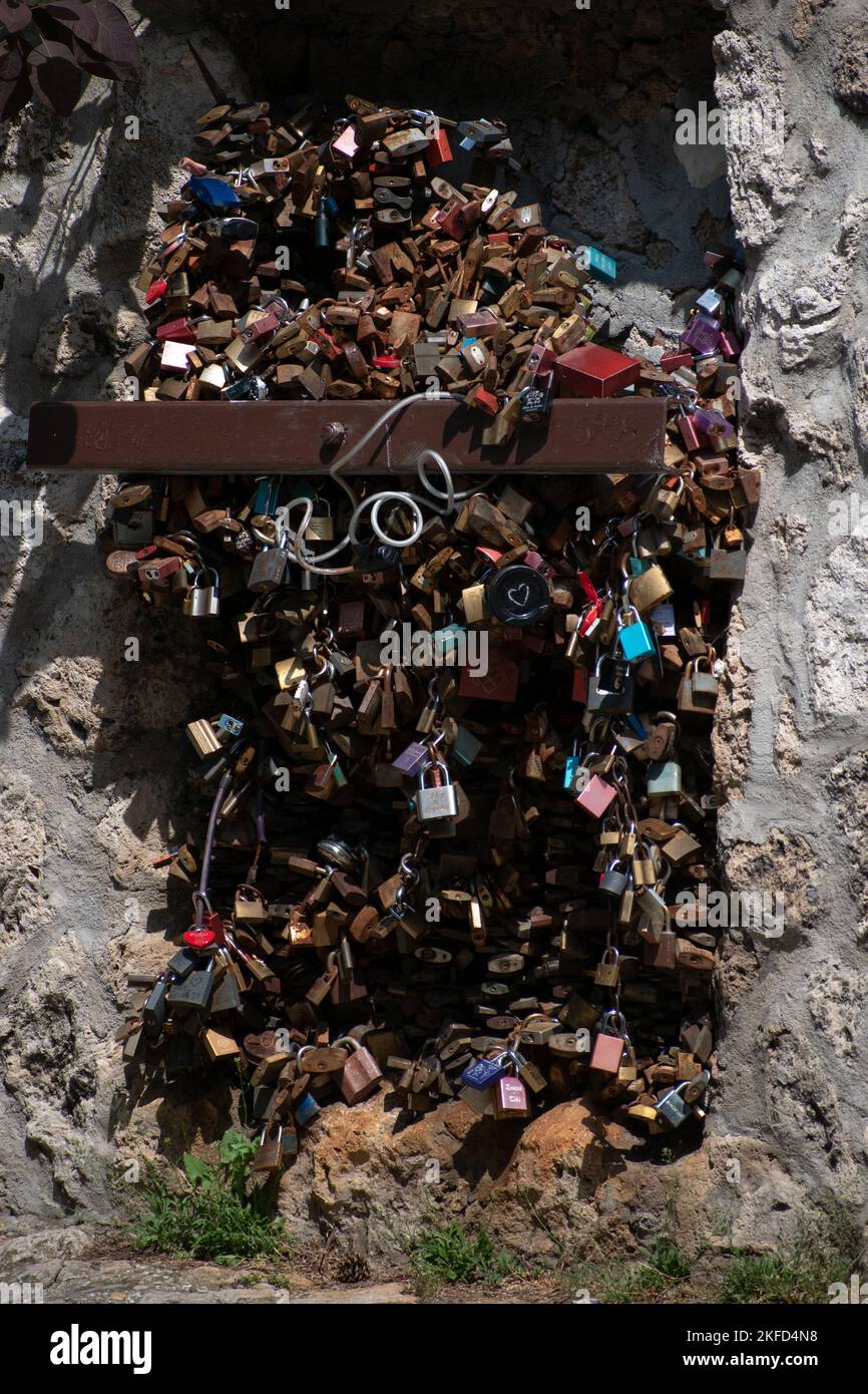 A vertical shot of a pile of love padlocks at the Tatai Patara festival ...