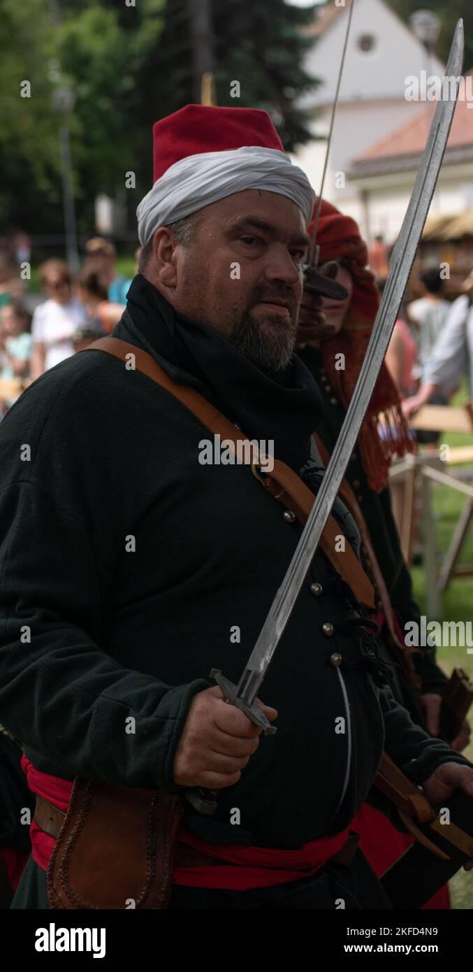 A vertical shot of a male in a historic costume at the Tatai Patara ...