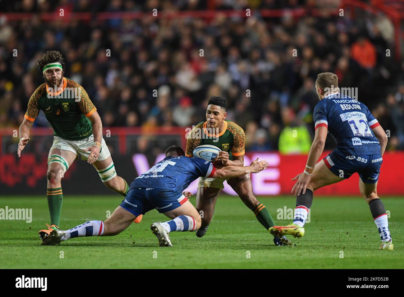 Sacha Feinberg-Mngomezulu of South Africa, tackled by Bryan Byrne of ...
