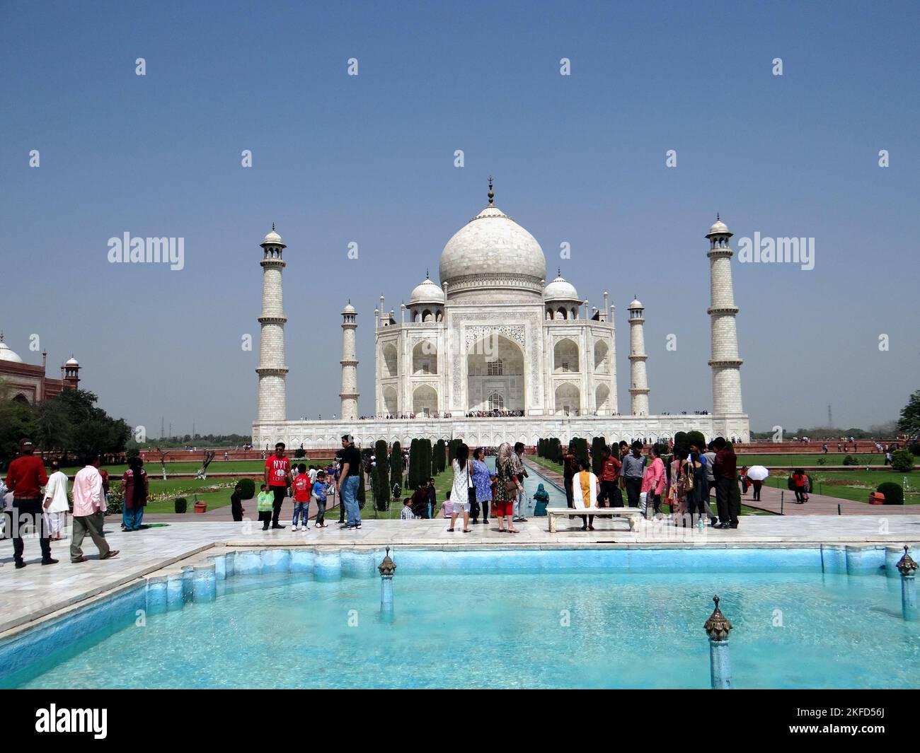 The Taj Mahal with tourists visiting the famous landmark in Agra, India ...