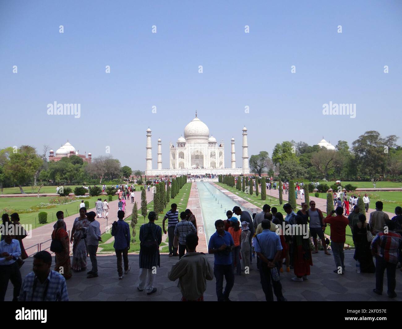 The Taj Mahal with tourists visiting the famous landmark in Agra, India ...