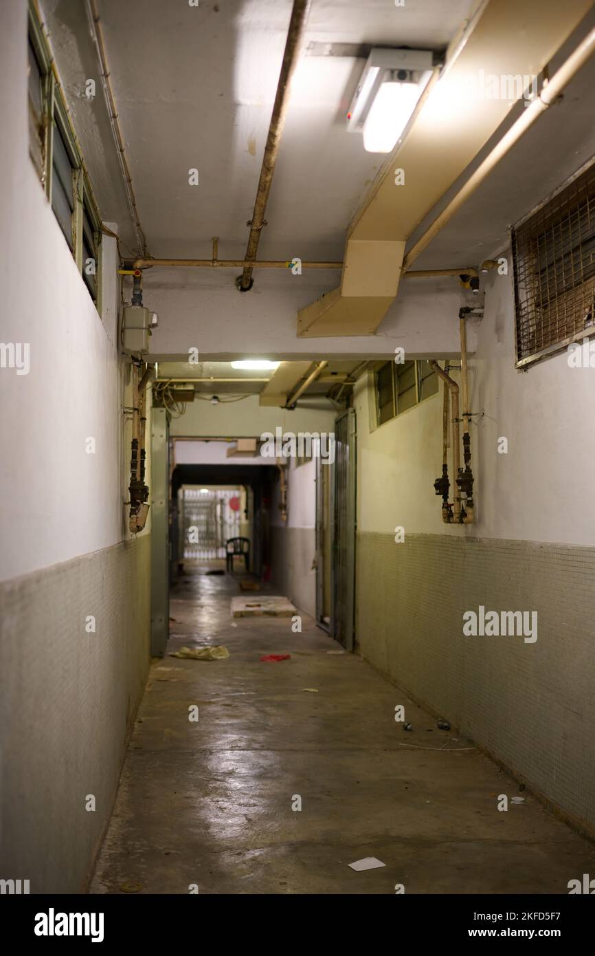A vertical shot of a corridor of an old-style public housing estate in ...
