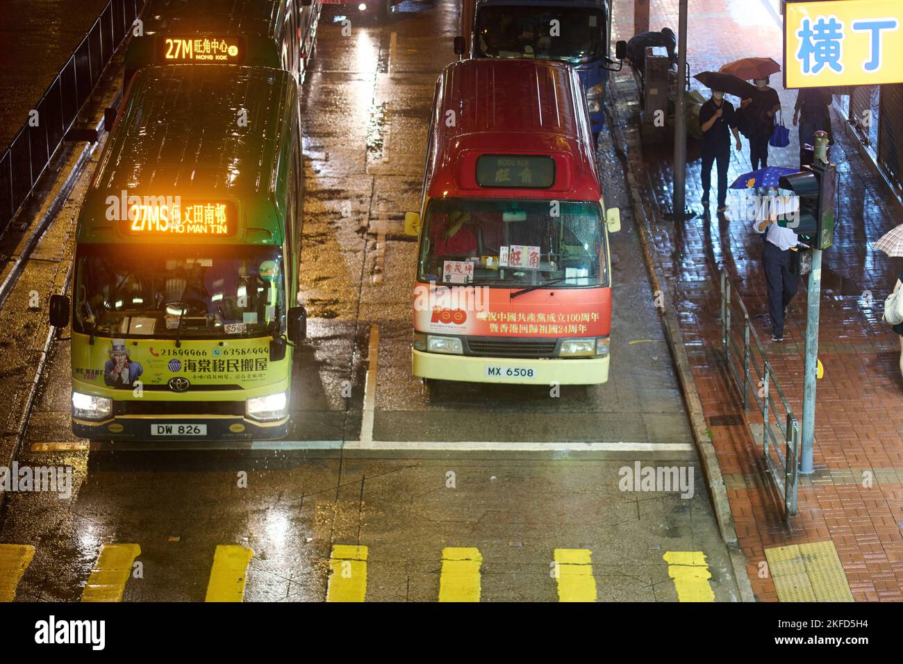 Two buses during night traffic in Sai Yee Street in Mong Kok, Hong Kong ...