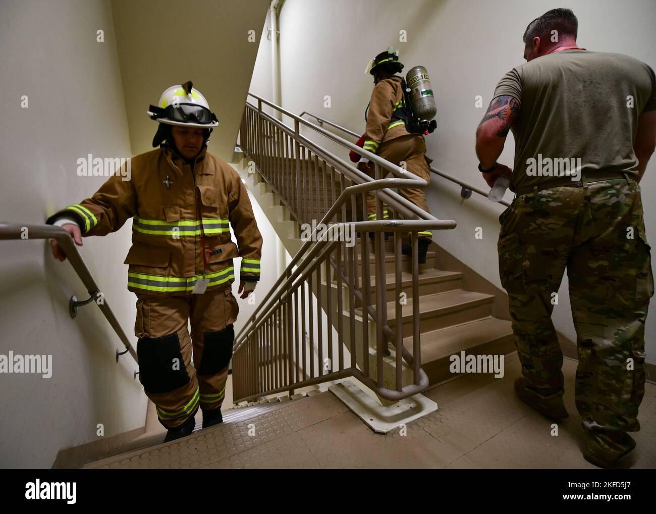 8th Civil Engineer Squadron firefighters climb stairs during a 9/11 ...