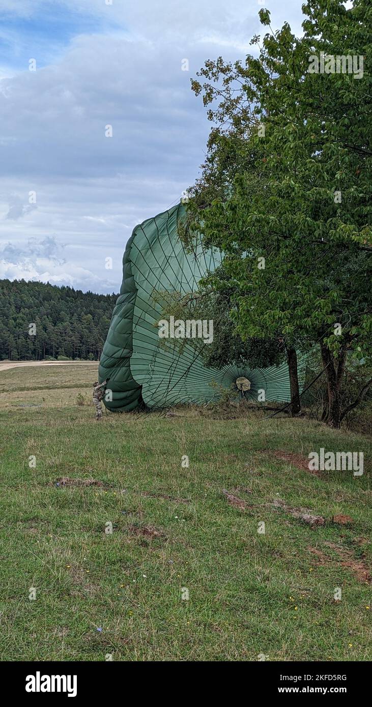 A U.S. Army Soldier assigned to the 173rd Airborne Brigade untangles a ...