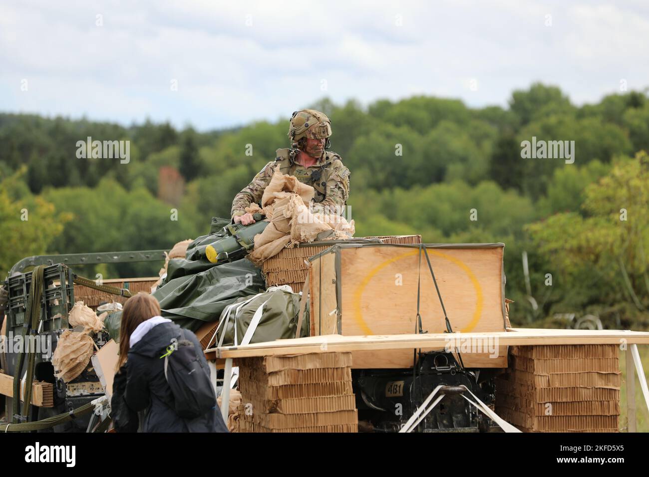 A U.S. Army Soldier assigned to the 173rd Airborne Brigade unpackages a ...