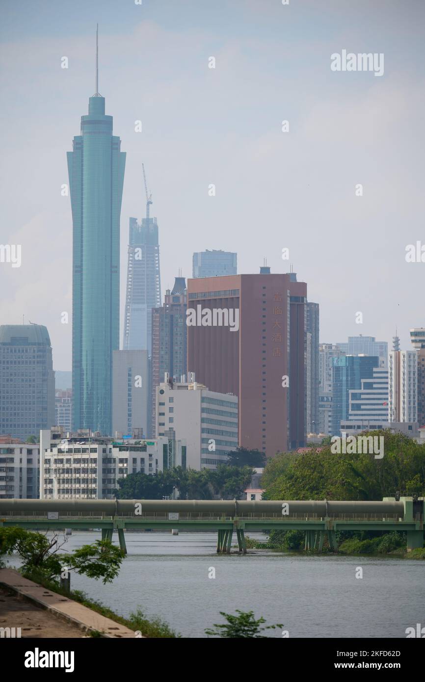 A vertical shot of Sheung Yu River in Lo Wu, Hong Kong with tall ...