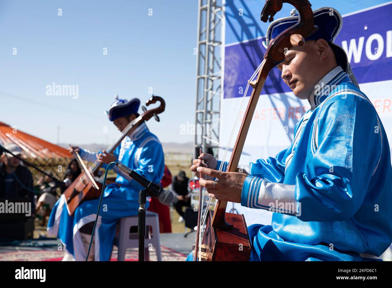 Mongolian musicians play the morin khuur, or horsehead fiddle, during ...