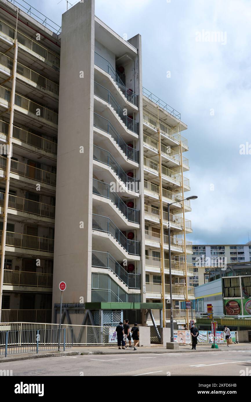 A vertical urban shot of an old residential building in Wah Fu Estate ...