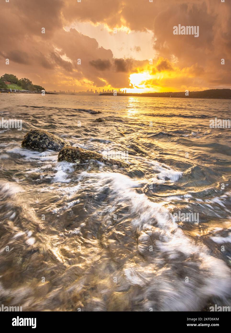 The reflection of the cloudy blue sky and the water is calm in Watsons ...