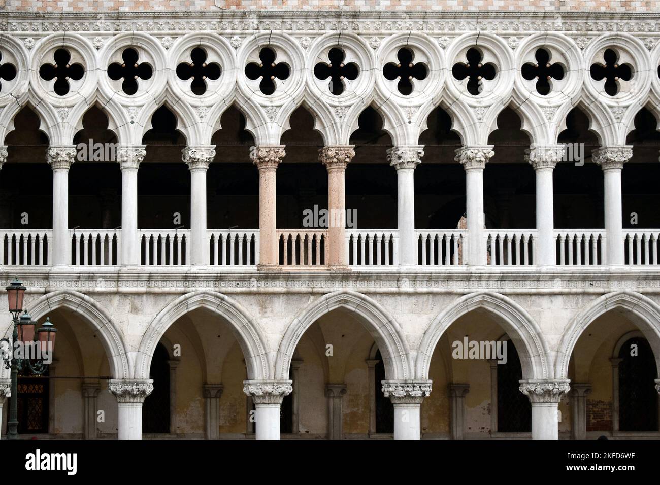 A closeup of an old church exterior with beautiful arches and columns ...