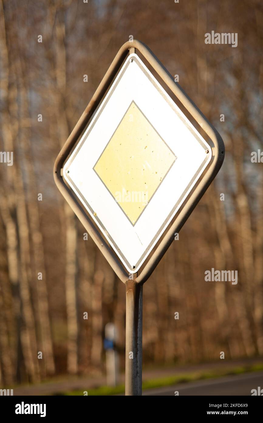 A priority road sign for cars, motorcycles, and trucks Stock Photo - Alamy