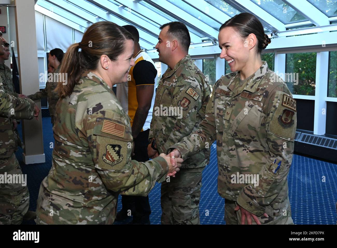 Col. Taona Enriquez, installation commander, congratulates Senior ...