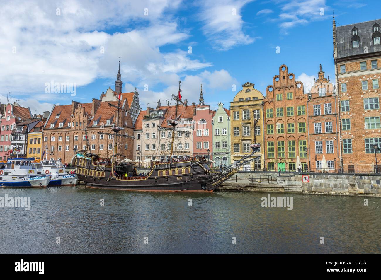 A beautiful shot of the beautiful old town buildings and water trams at ...