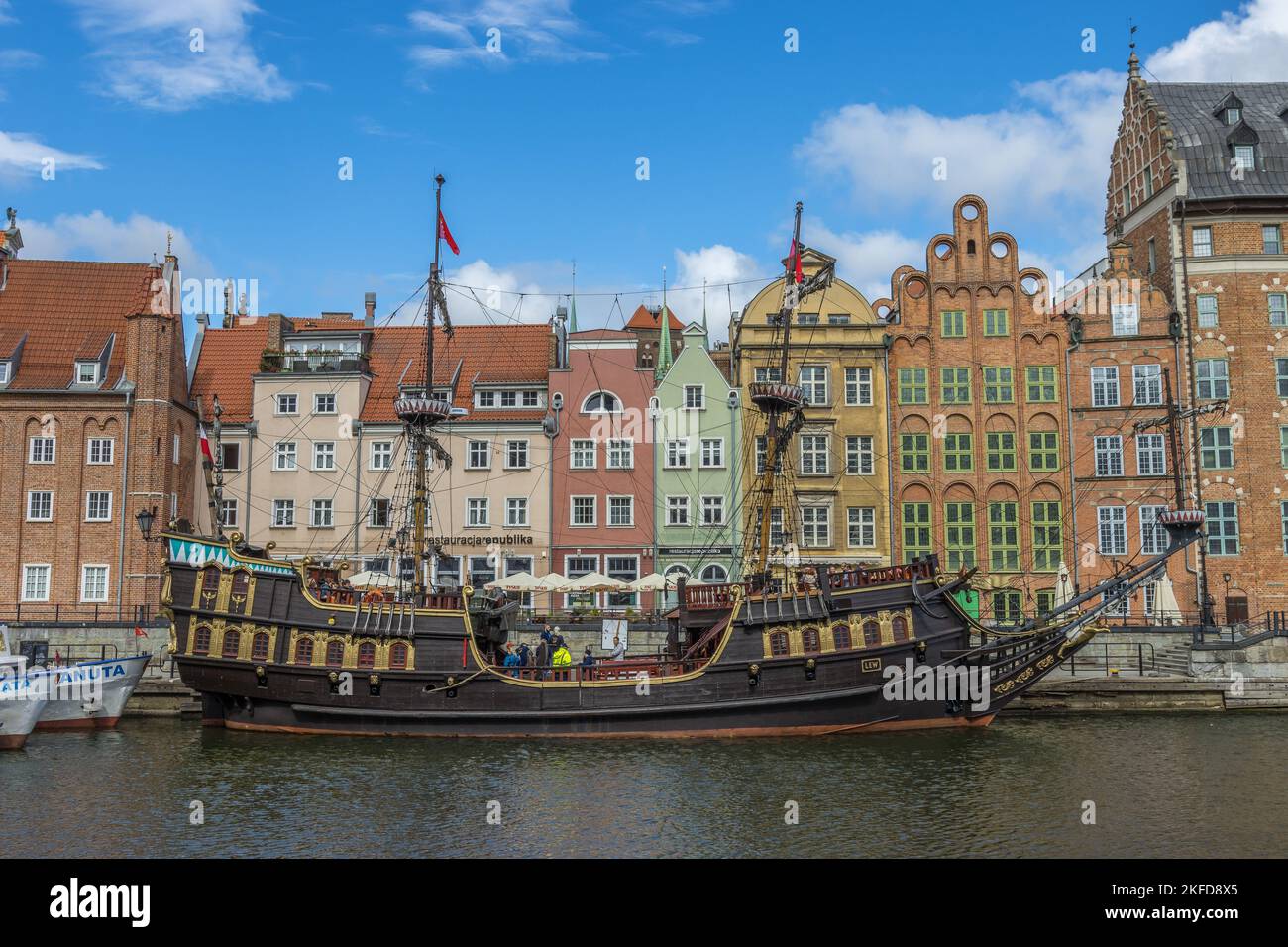 A beautiful shot of the beautiful old town buildings and water trams at ...