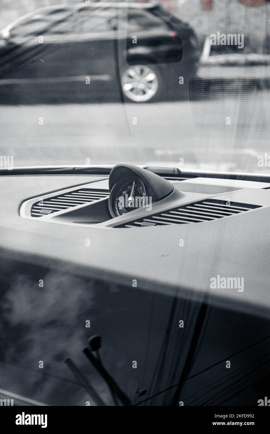 A greyscale shot of a Porsche 992 Generation Dashboard Analog Clock ...