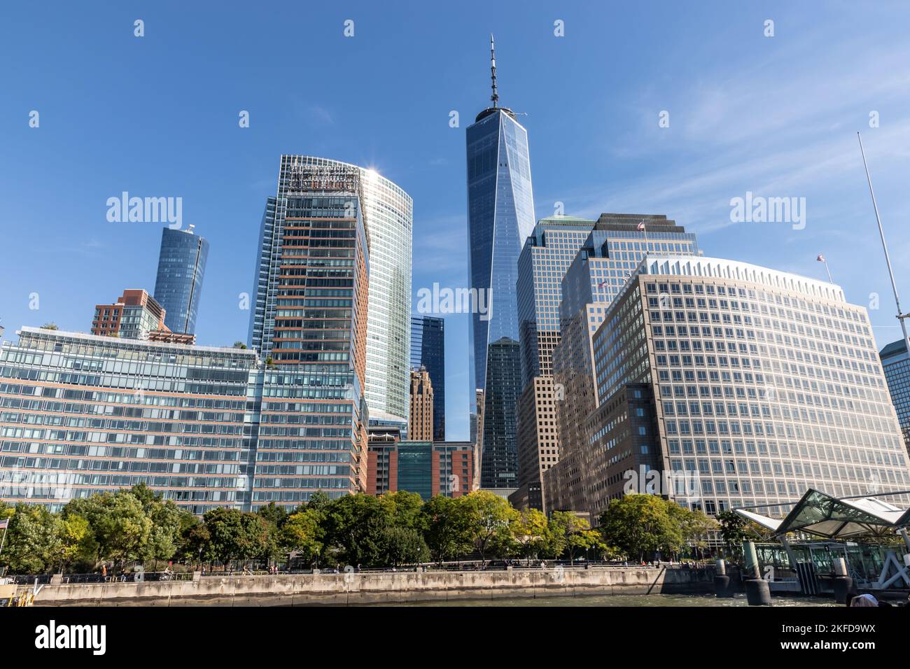The famous Freedom Tower and buildings around blue sky Stock Photo - Alamy