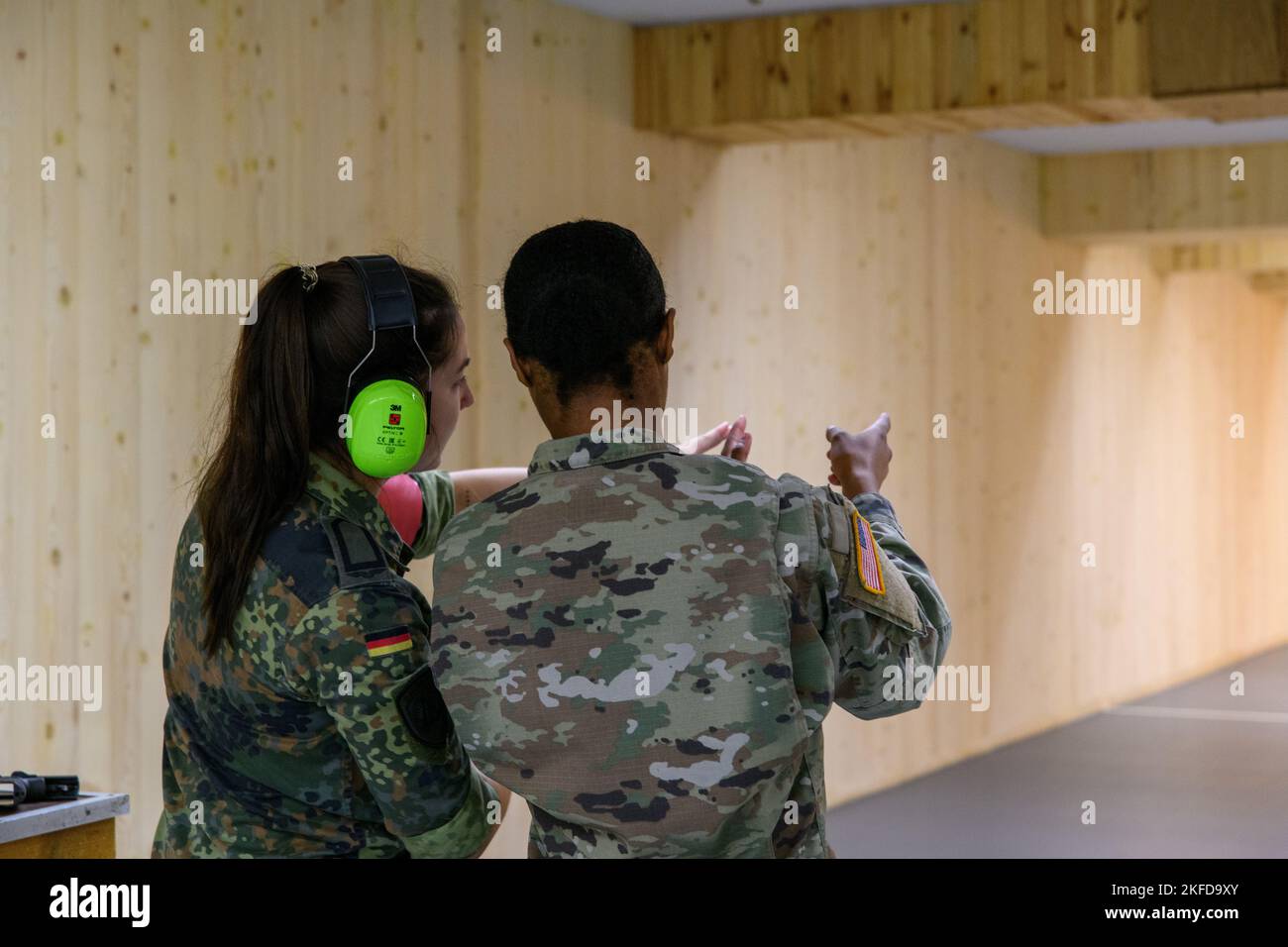 A German range safety instructs a U.S. Soldier with 39th Strategic ...