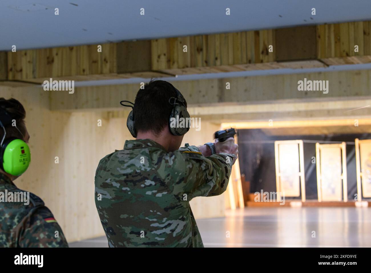 A U.S. Soldier with 39th Strategic Signal Battalion practices shooting ...