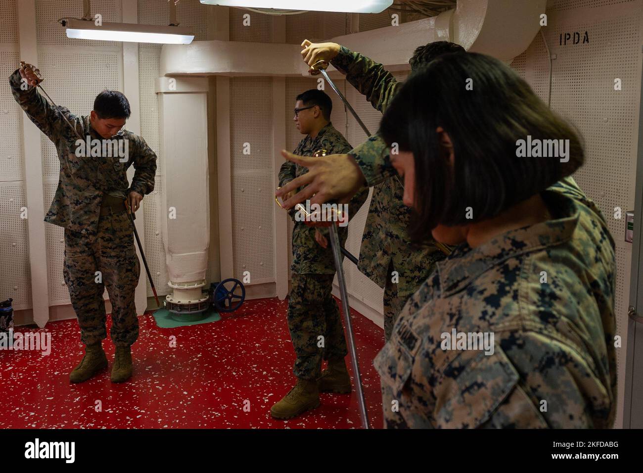 U.S. Marines with 31st Marine Expeditionary Unit practice sword manual ...