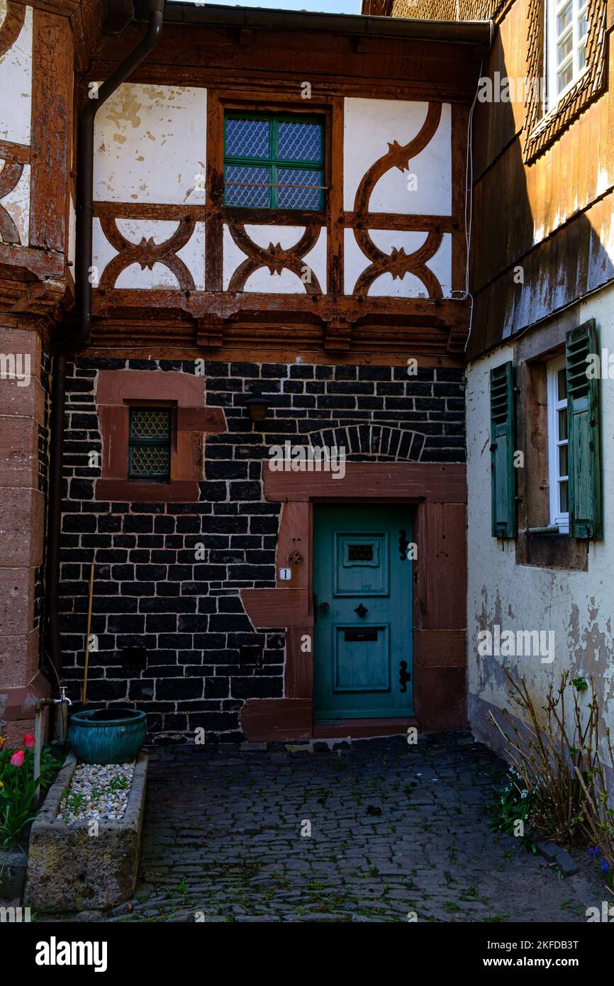 A vertical shot of a small entrance in Ramholz Castle in Schluechtern ...