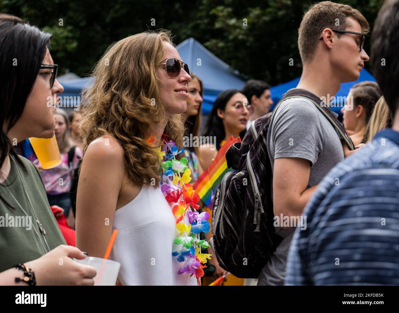 People enjoying gay pride in Europe with LGBT flags Stock Photo - Alamy