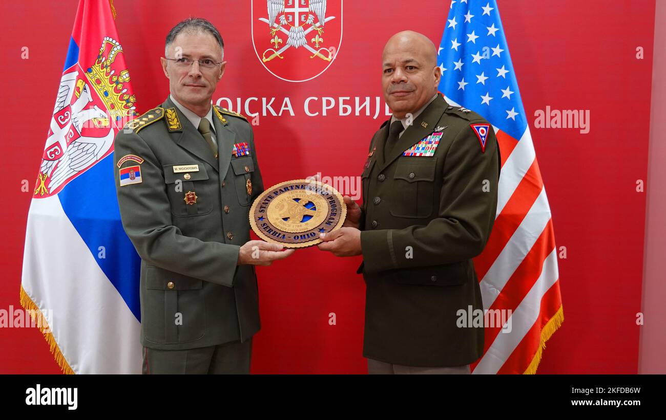 Maj. Gen. John C. Harris Jr. (right), Ohio adjutant general, presents a ...
