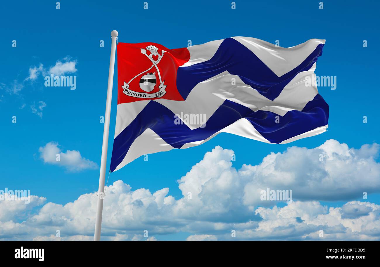 flag of Bantu peoples Nyoro people at cloudy sky background, panoramic ...