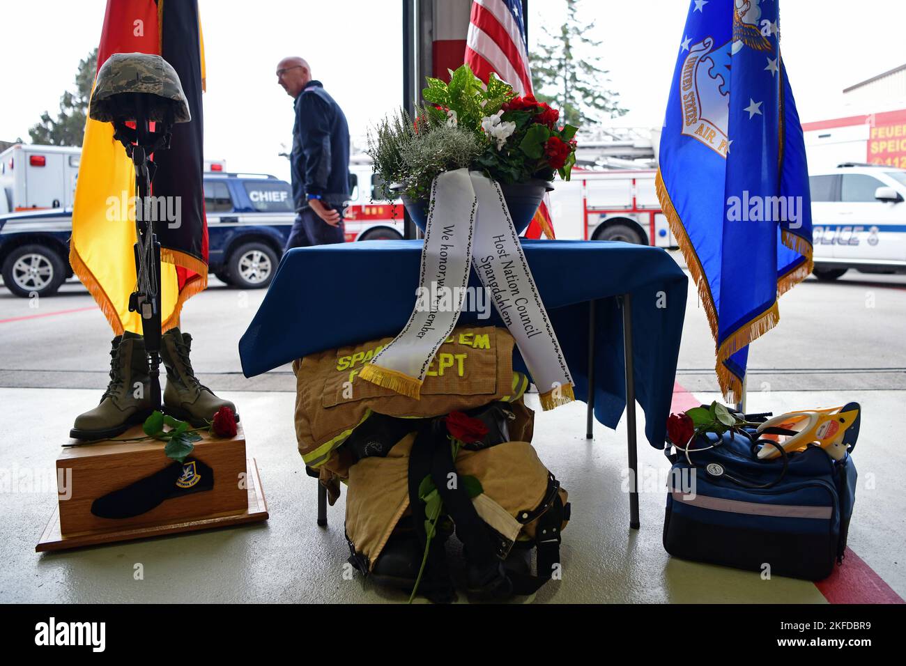 A floral arrangement rests on a table during a 9/11 Remembrance ...