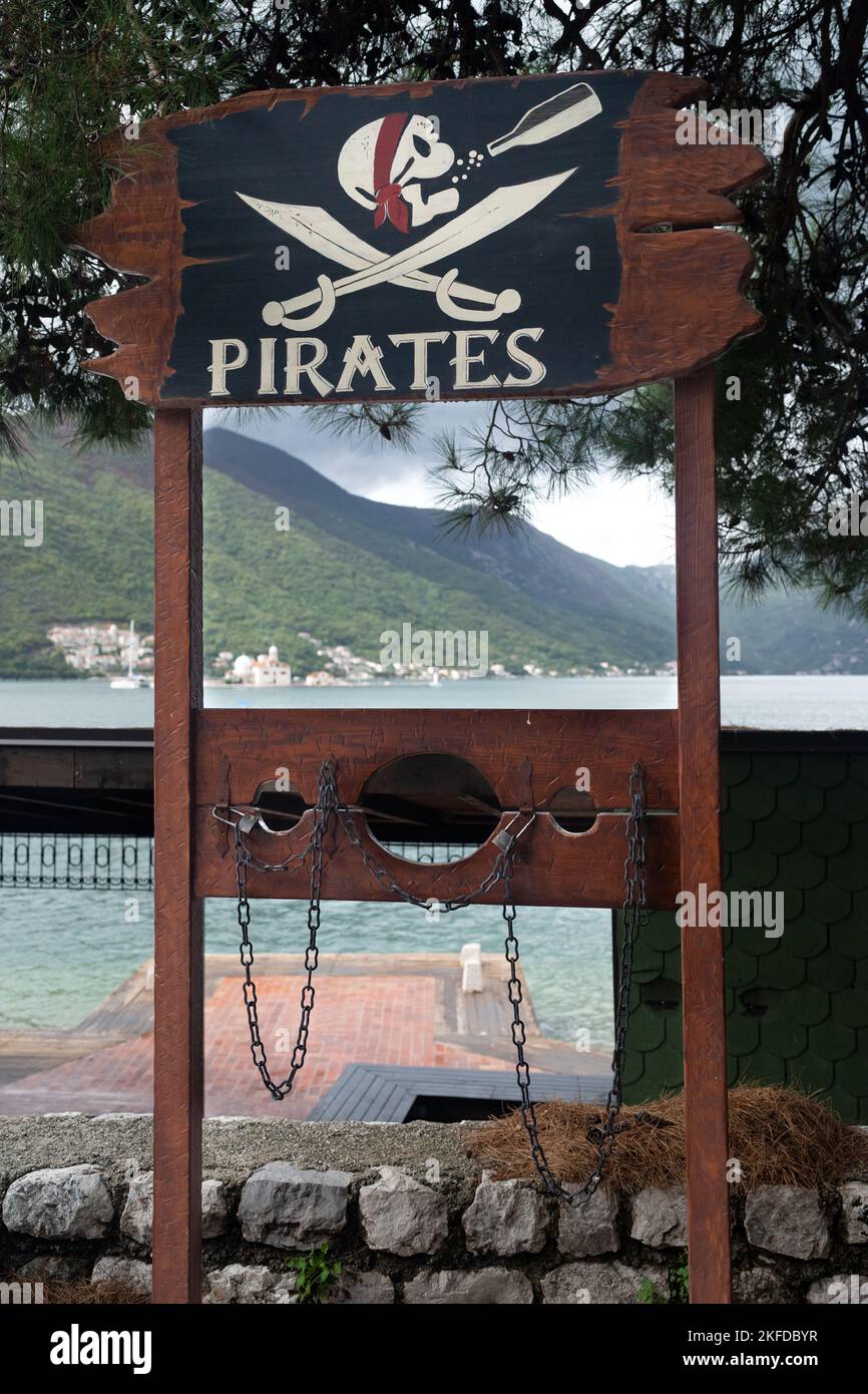 Pirate Sign over wooden pillory Stock Photo - Alamy
