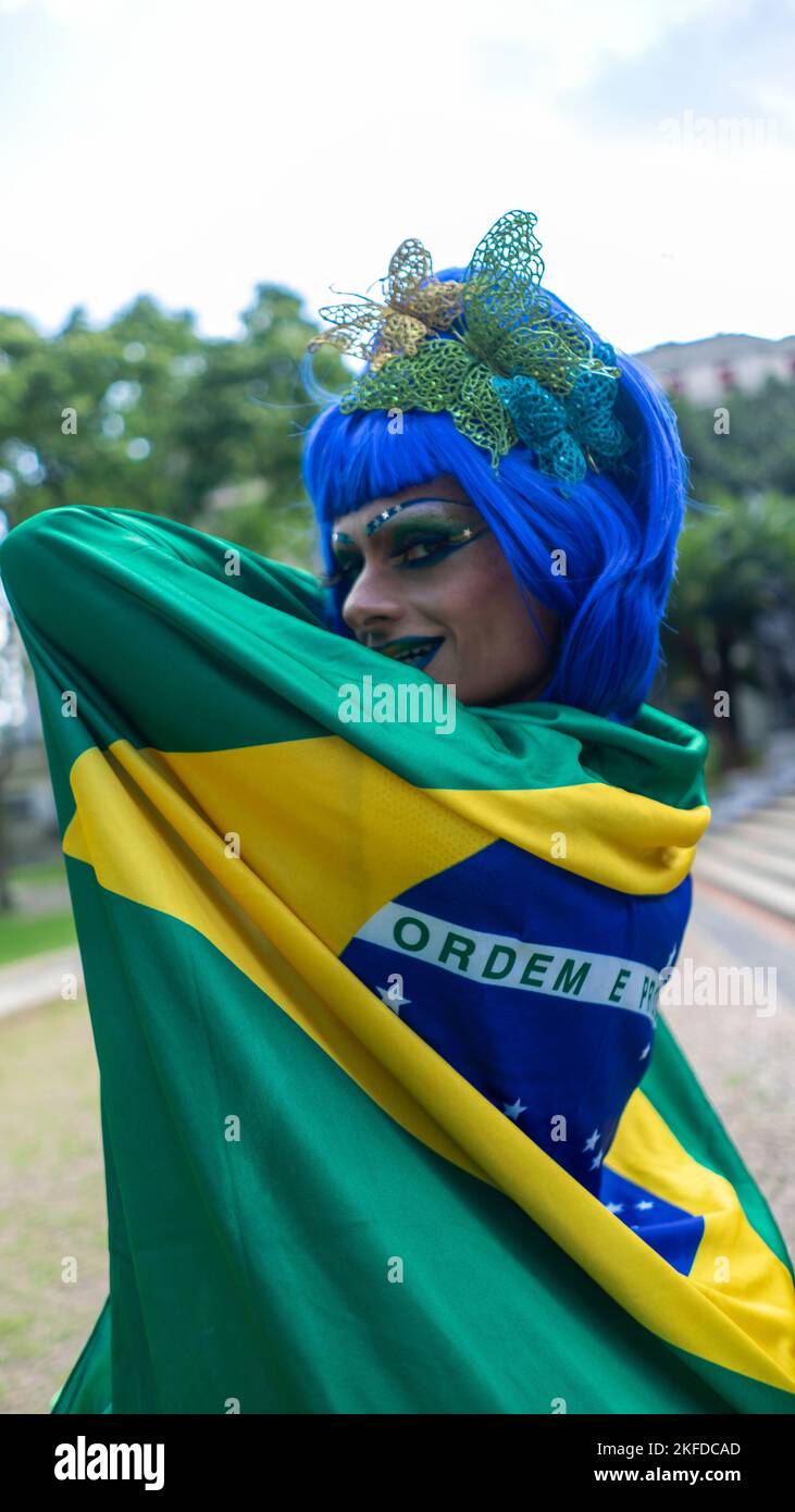 Dragqueen in her green and yellow outfit and makeup cheering during the ...