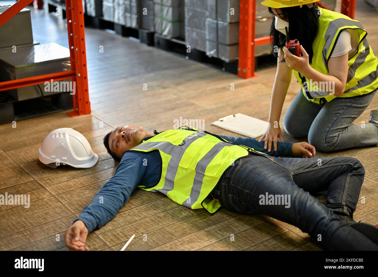 A female warehouse worker using a walkie-talkie called the factory's ...