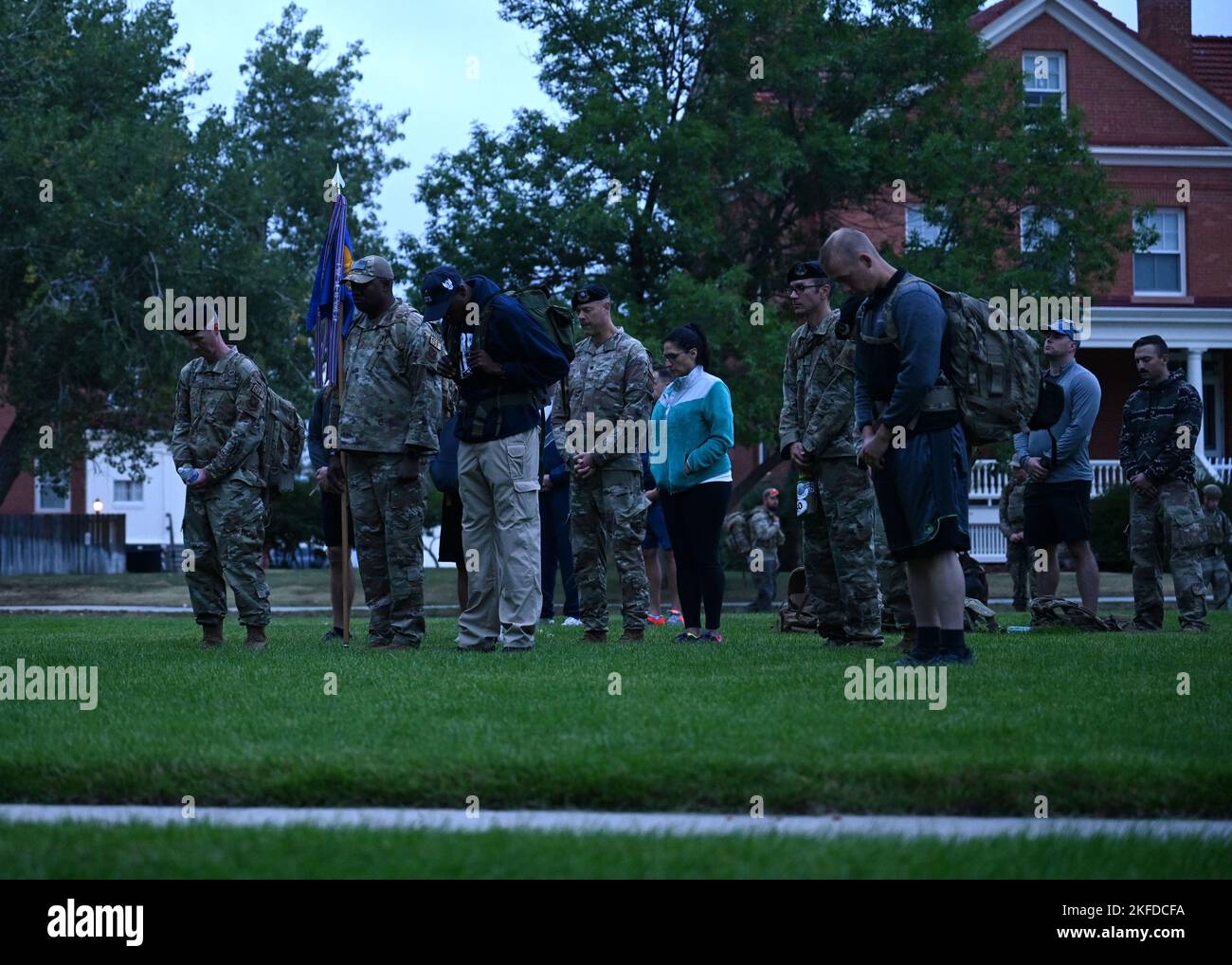Members from the 90th Missile Wing stand fora moment of silence to ...