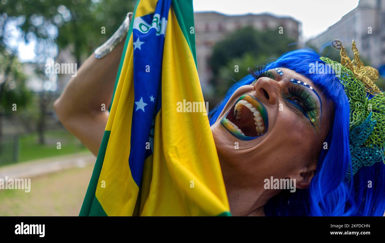 Dragqueen in her green and yellow outfit and makeup cheering during the ...