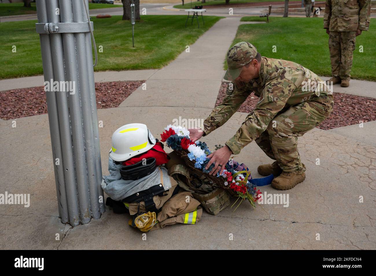 Tech Sgt. Jason Tyson, fire department safety assistant chief, lays a ...